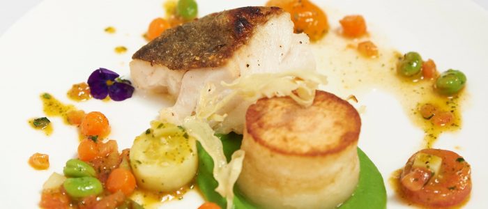 Pan roast cod, potatoes fondant with garden peas and vegetables with ...